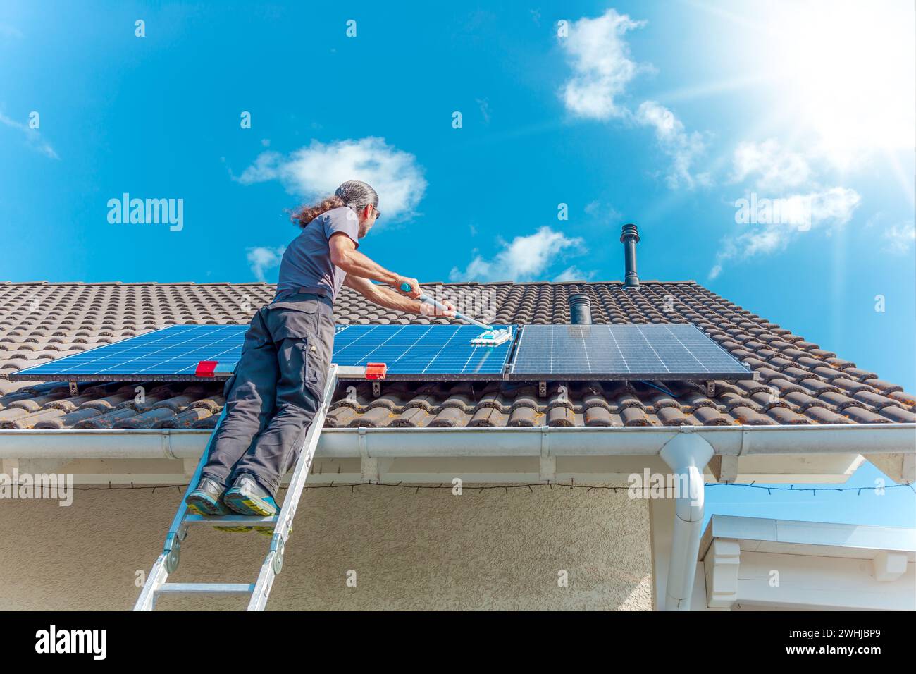 Man cleaning sun panels close hi-res stock photography and images - Alamy