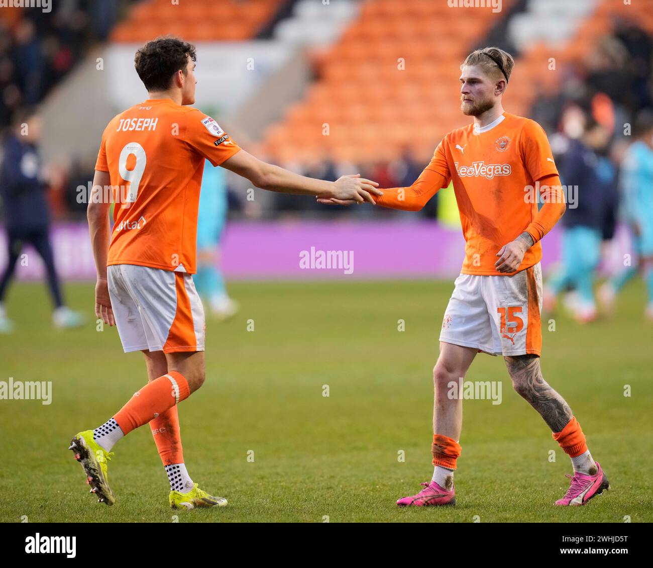 Kyle Joseph of Blackpool shakes hands with Hayden Coulson of Blackpool ...