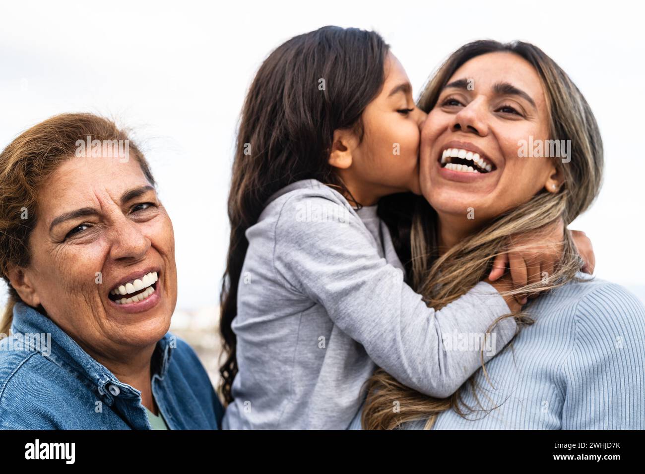 Happy Hispanic family enjoying time together - Child having fun with ... Happy Hispanic family enjoying time together - Child having fun with ...
