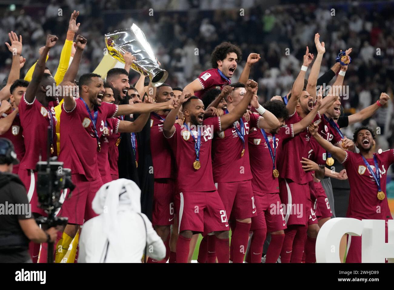 Qatar players celebrate with the trophy after winning the Asian Cup ...