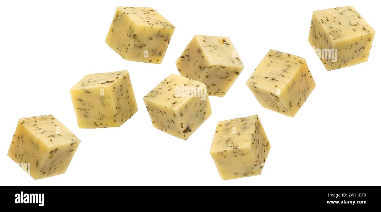 Falling Gouda cheese cubes with herbs isolated on white background ...