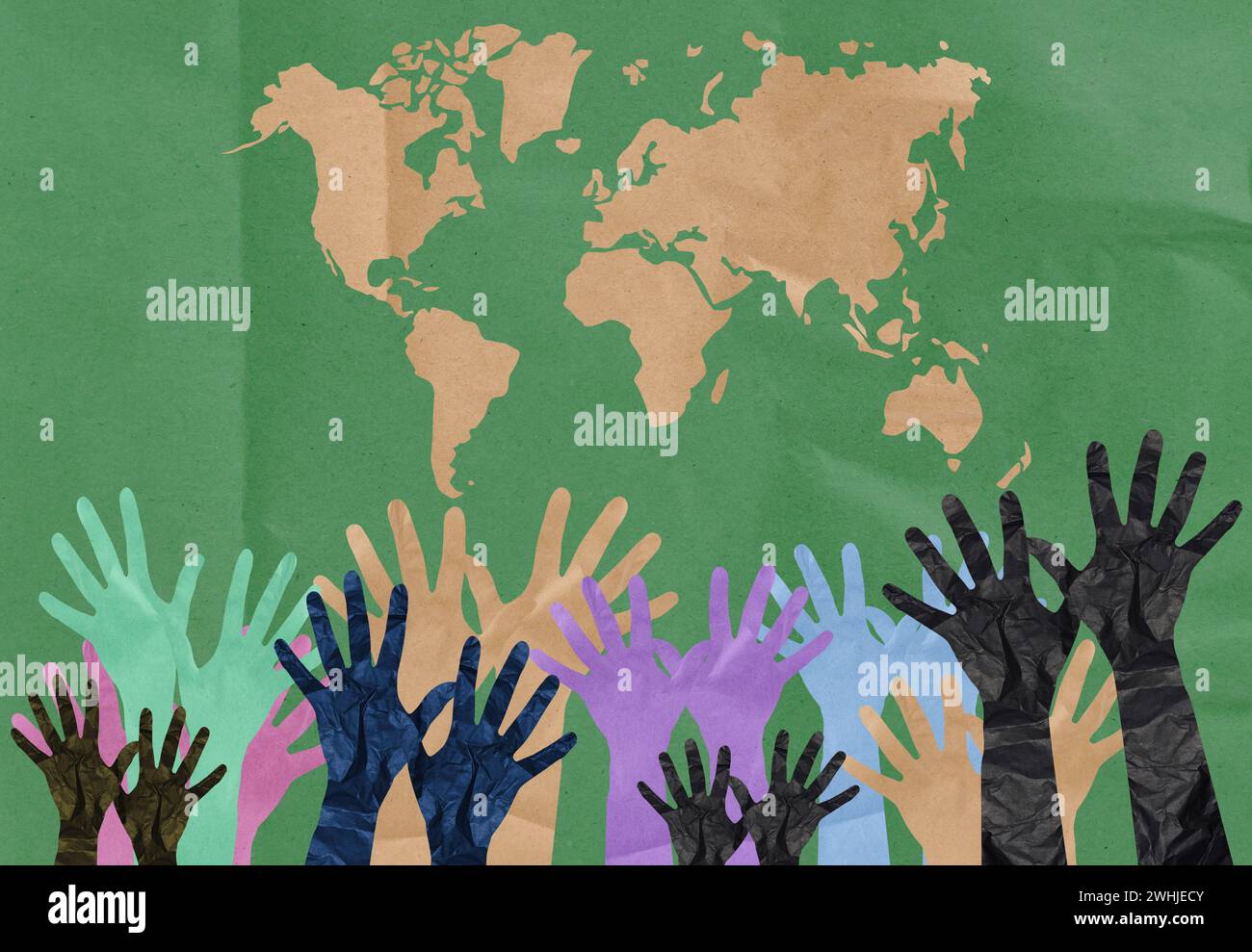 Paper multi-colored hands reach for the continents of the earth, the ...