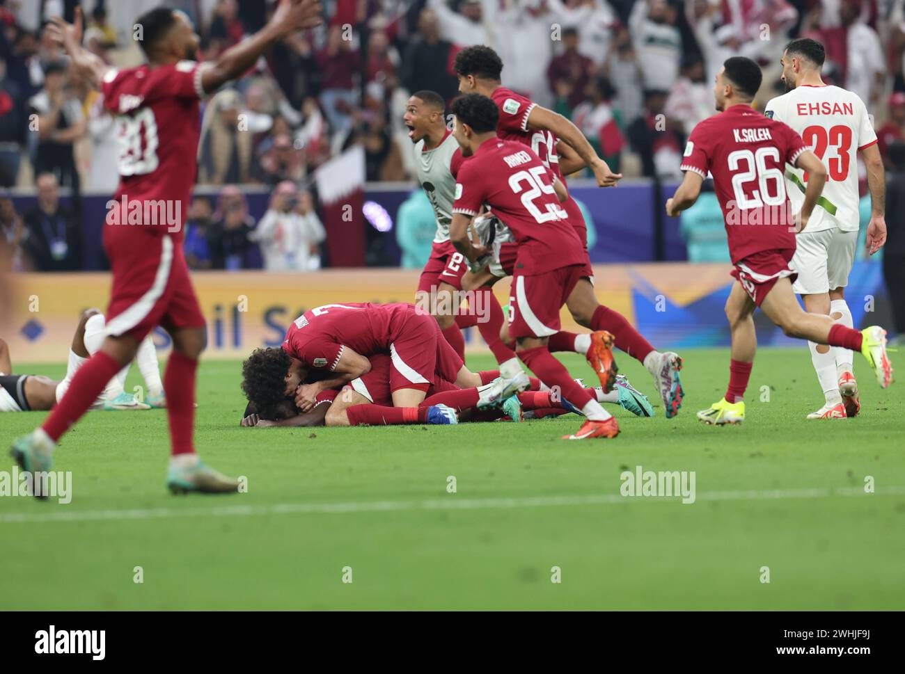 Lusail, Qatar. 10th Feb, 2024. Players of Qatar celebrate victory after ...