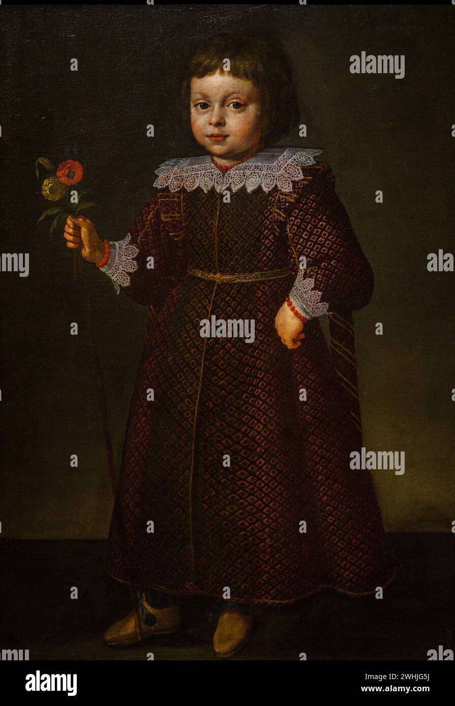 Boy holding a cane and the attribute of Saint Joseph Stock Photo - Alamy