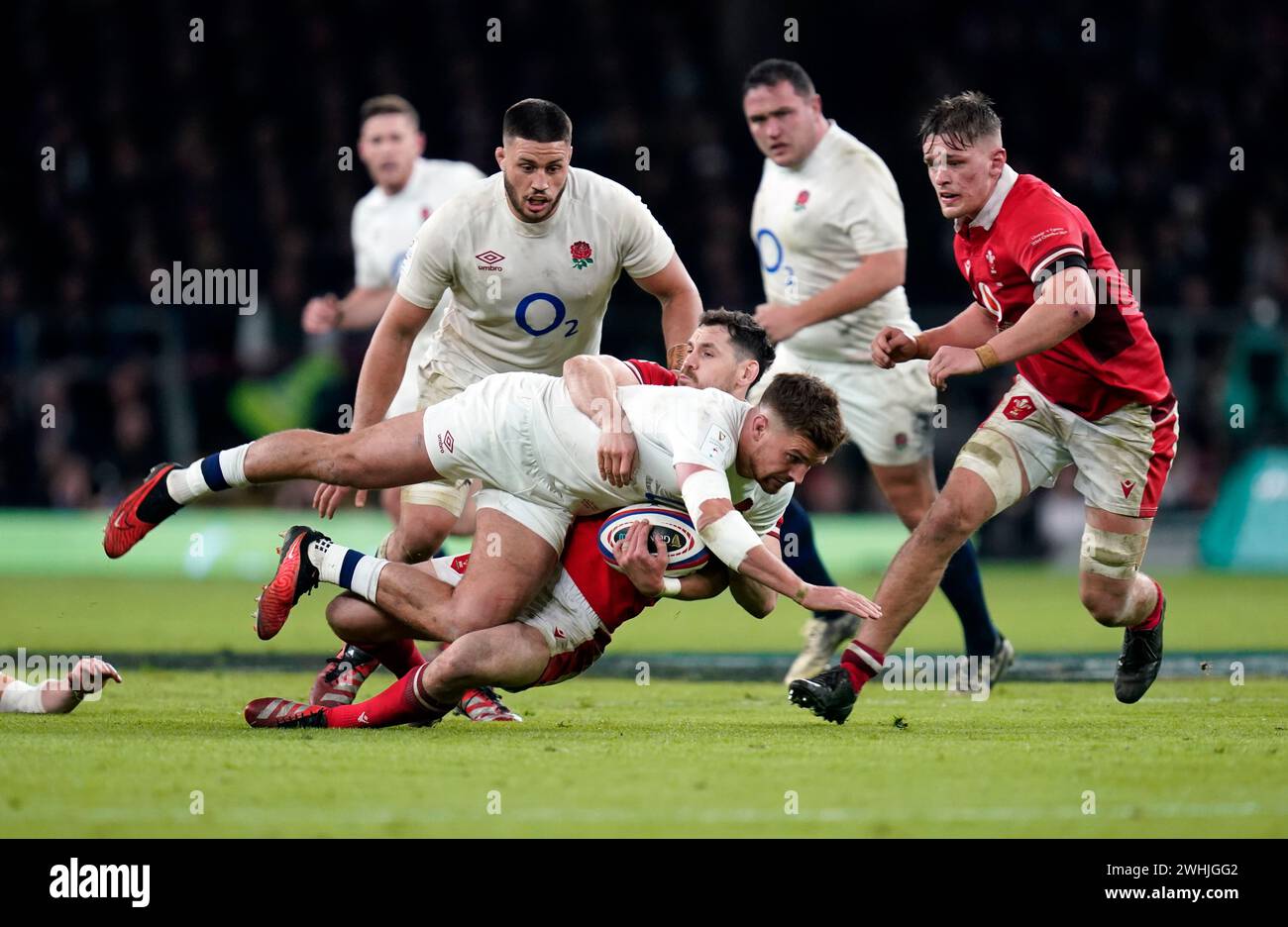 England's Henry Slade is tackled by Wales's Tomos Williams during the ...
