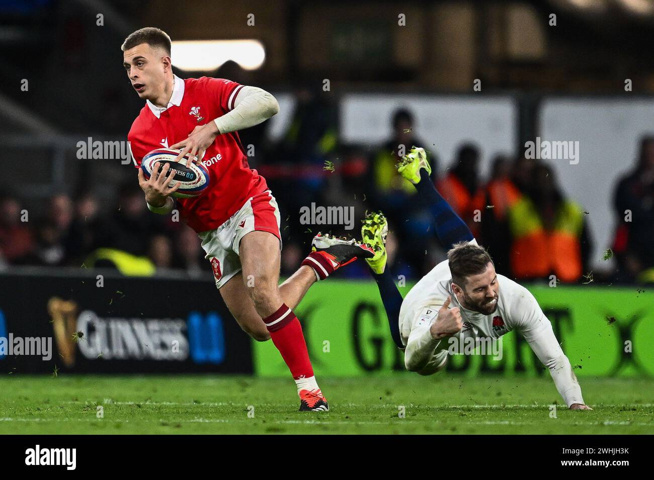 Cameron Winnett of Wales evades the tackle of Elliot Daly of England ...