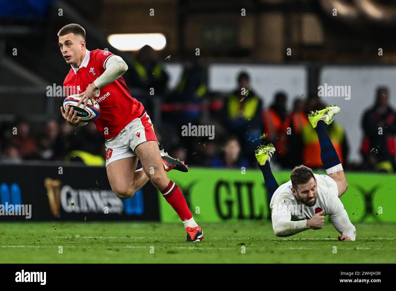 Cameron Winnett of Wales evades the tackle of Elliot Daly of England ...