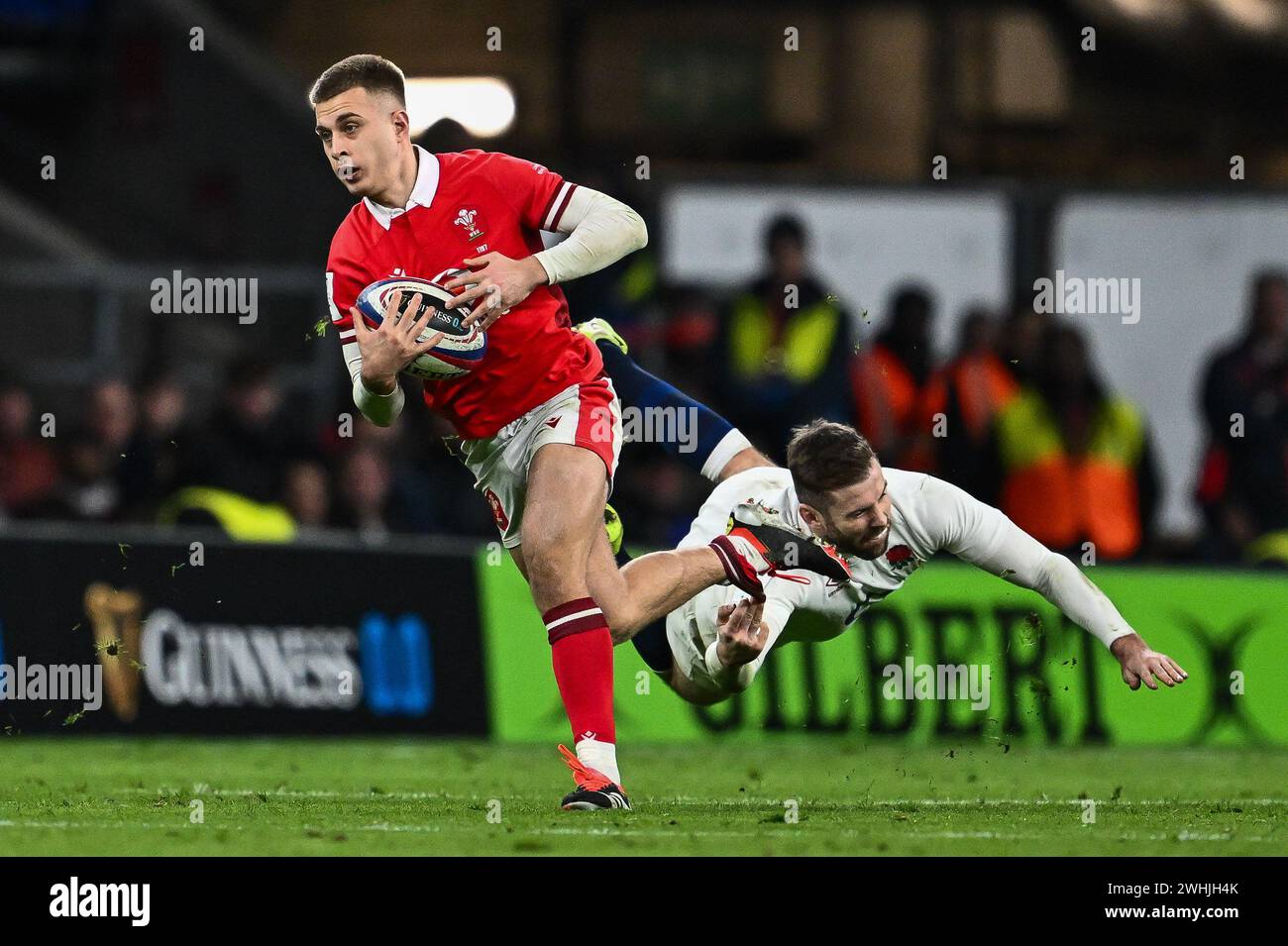 Cameron Winnett of Wales evades the tackle of Elliot Daly of England ...