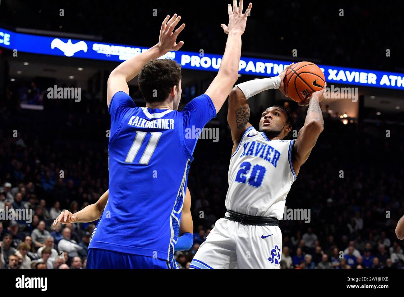 Xavier guard Dayvion McKnight (20) shoots over Creighton center Ryan ...
