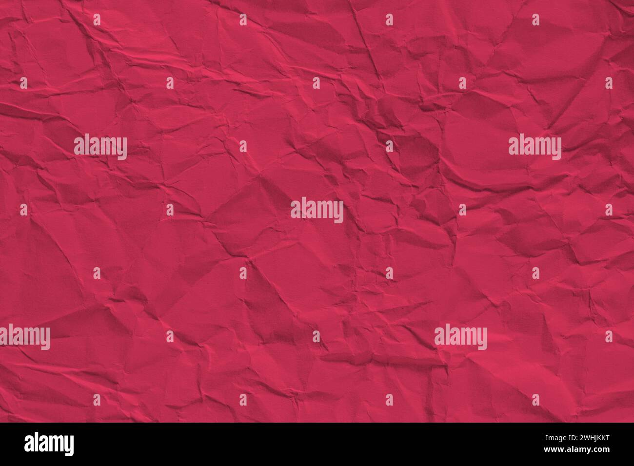 A vivid red crumpled paper texture that gives a sense of depth and ...