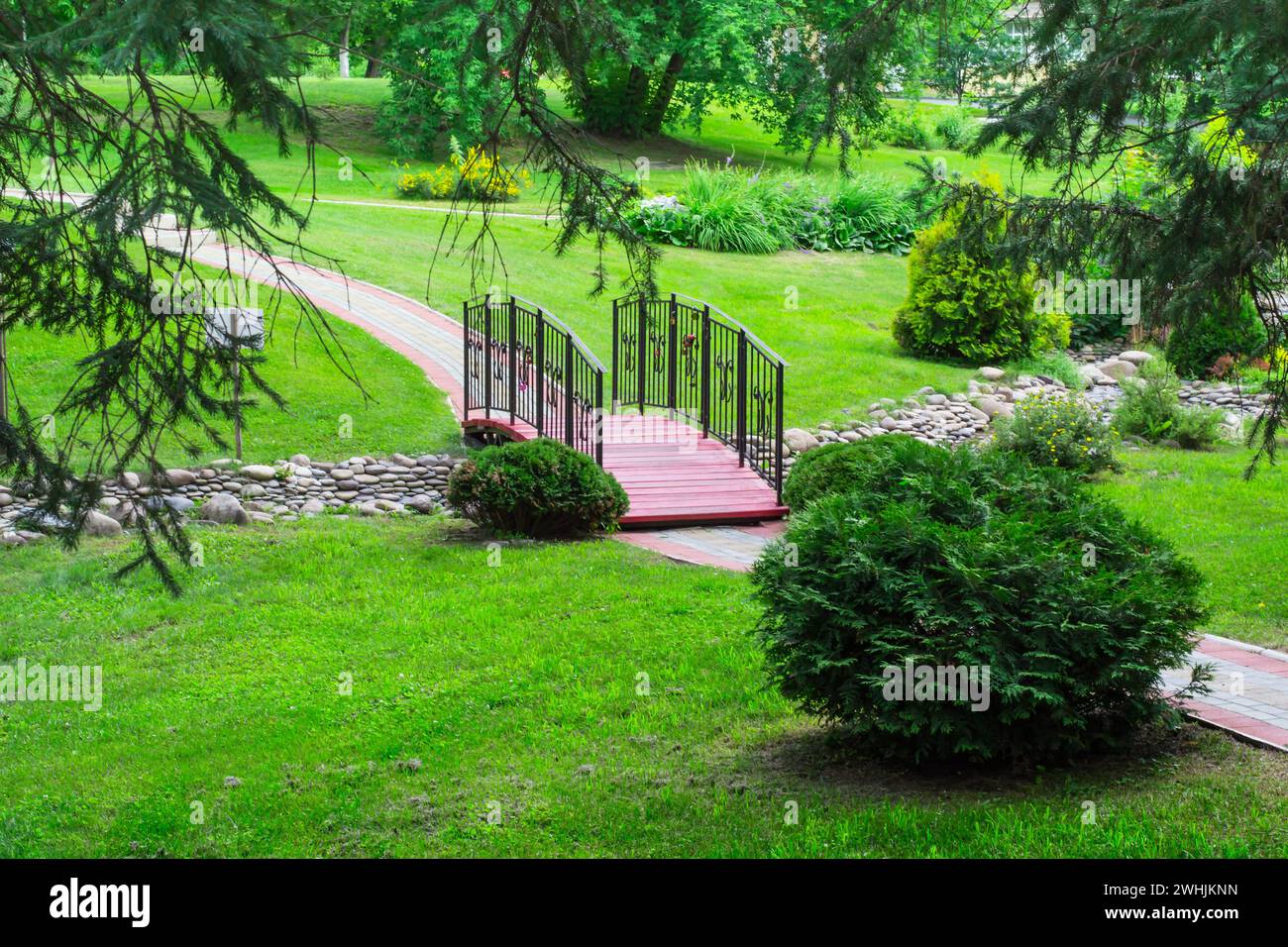 Bridge over the brook in the park. Landscape design concept Stock Photo ...