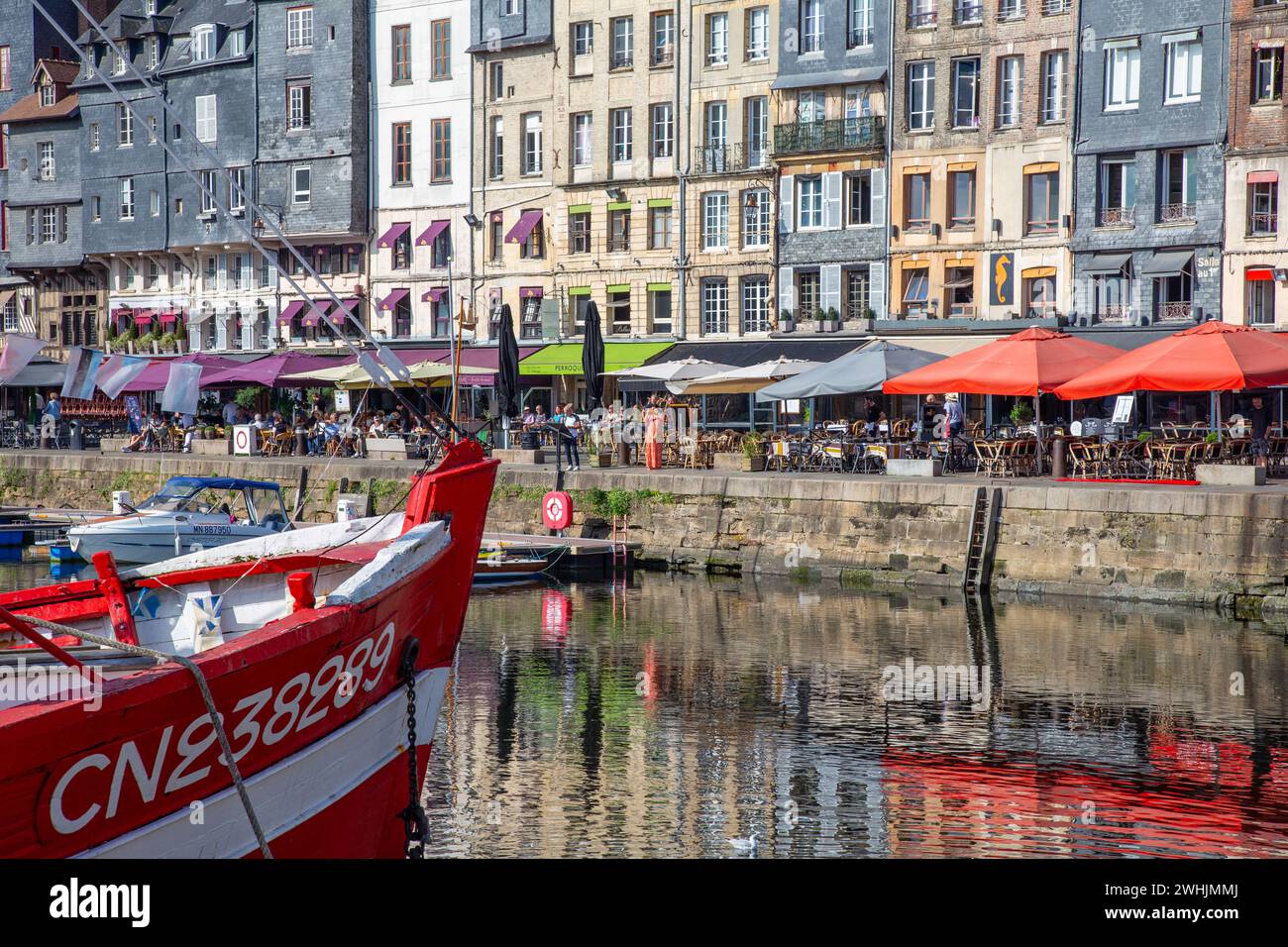 The old harbour lined with restaurants in Honfleur, Normandy, France ...