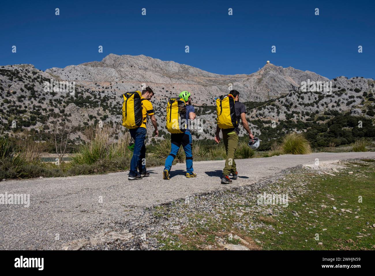 Three runners in long distance route GR 221 Stock Photo - Alamy