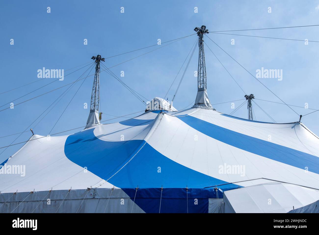 big blue and white circus tent under sunny sky Stock Photo - Alamy