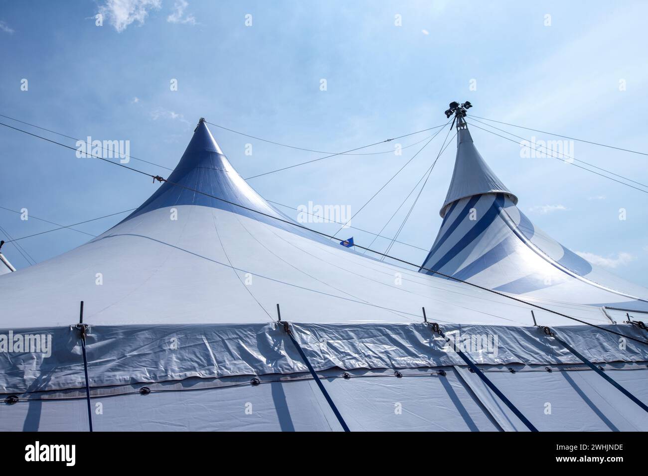 big blue and white circus tent under sunny sky Stock Photo - Alamy