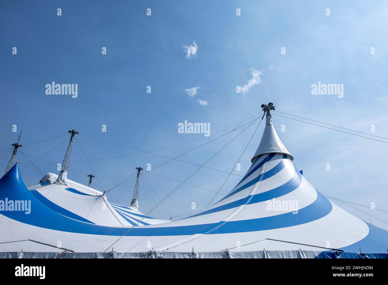 big blue and white circus tent under sunny sky Stock Photo - Alamy