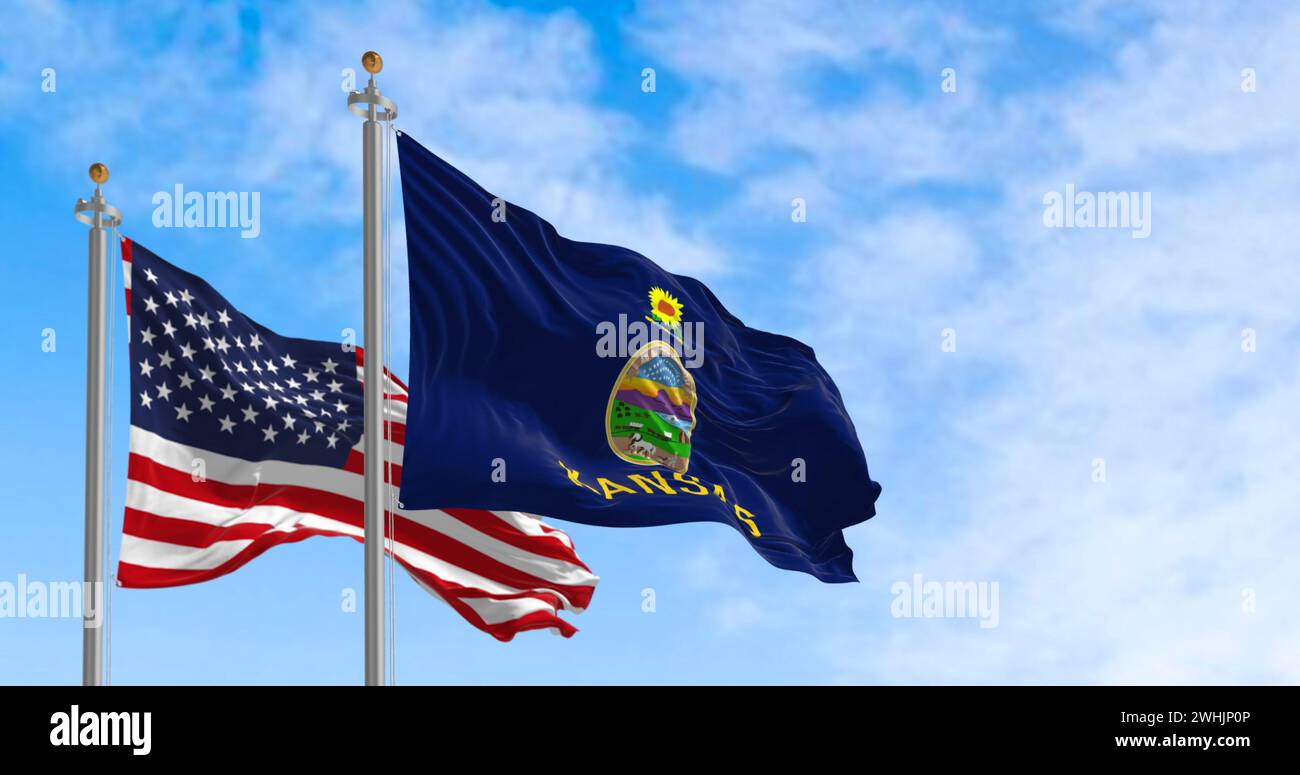 Kansas state flag waving with the national flag of the US on a clear ...