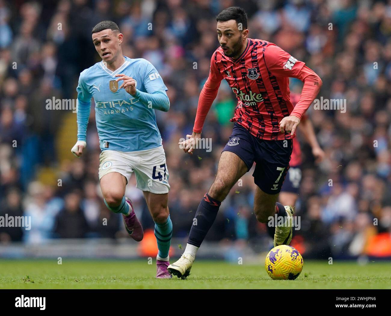 MANCHESTER, UK. 10th Feb, 2024. Dwight McNeil of Everton (R) is ...