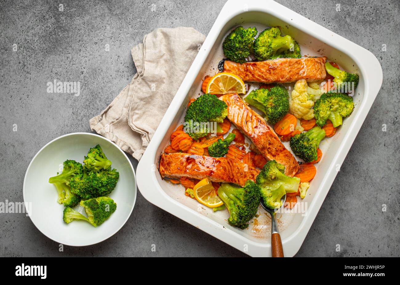 Top view of healthy baked fish salmon steaks, broccoli, cauliflower ...