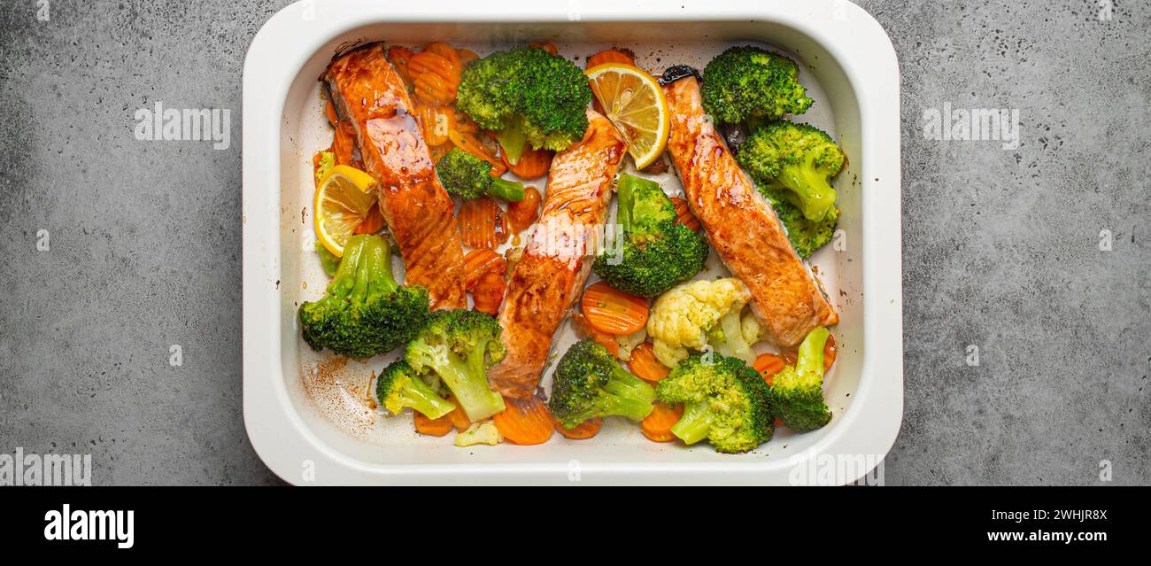 Top view of healthy baked fish salmon steaks, broccoli, cauliflower ...