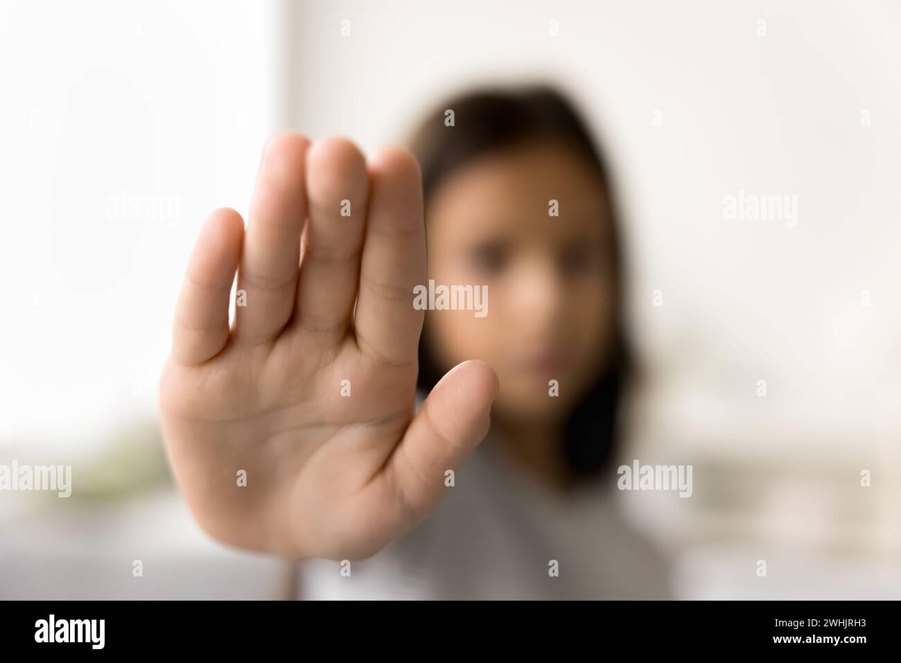 Scared kid making hand stop gesture, showing palm at camera Stock Photo ...