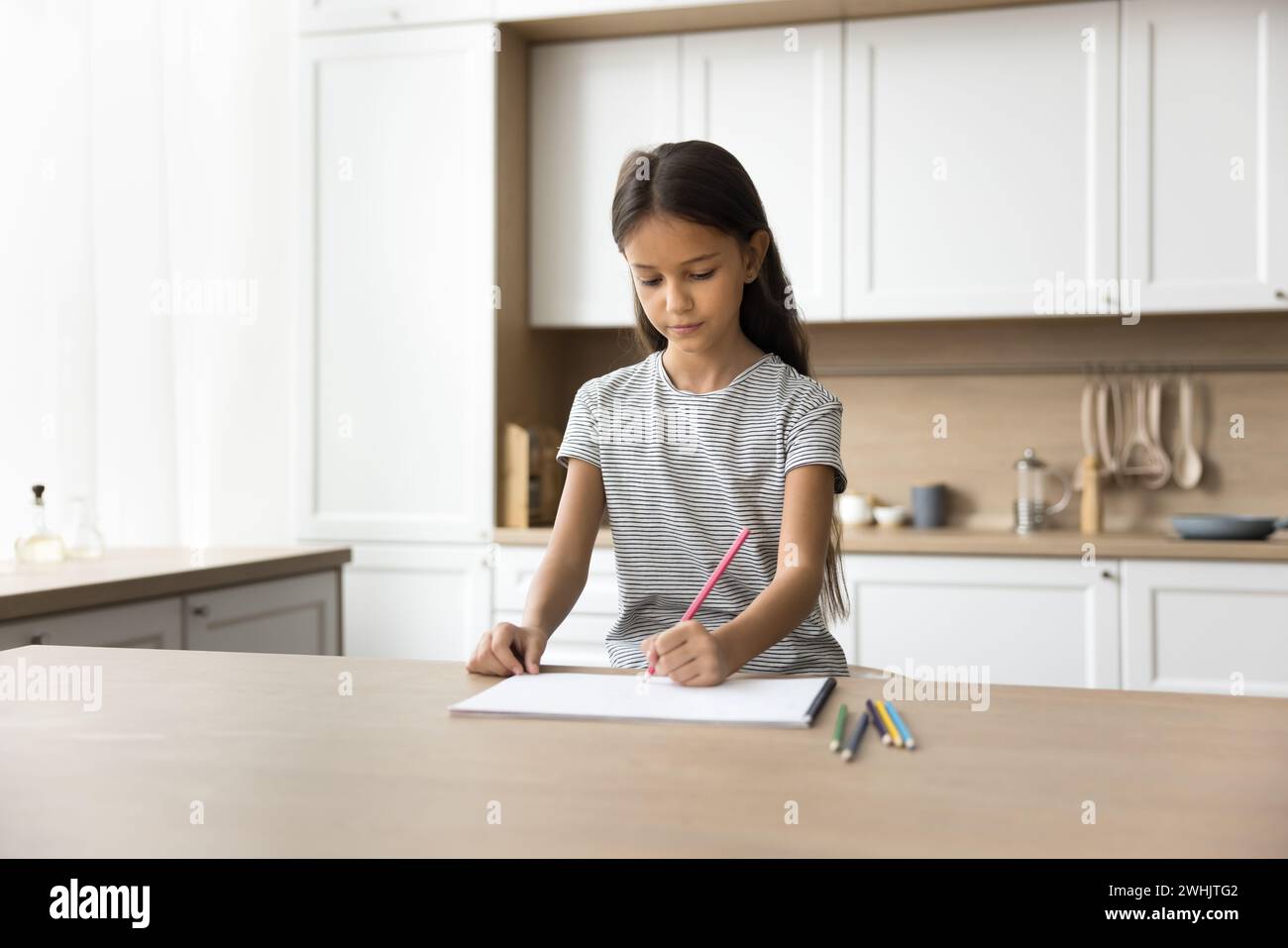 Focused preteen kid girl drawing colorful sketches, doodles Stock Photo ...