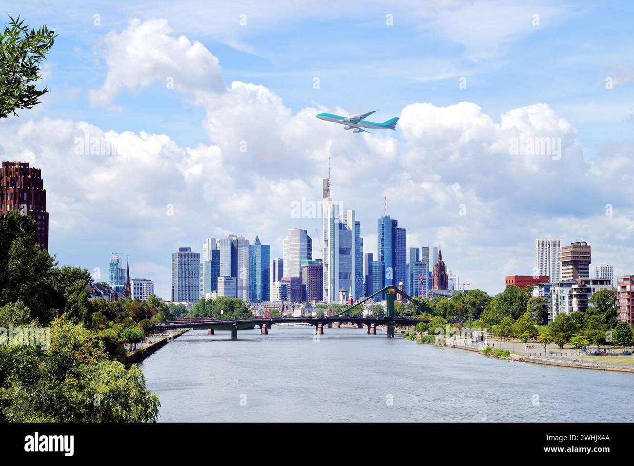 River - Main with european city skyline. Airliner is flying, Jet plane ...