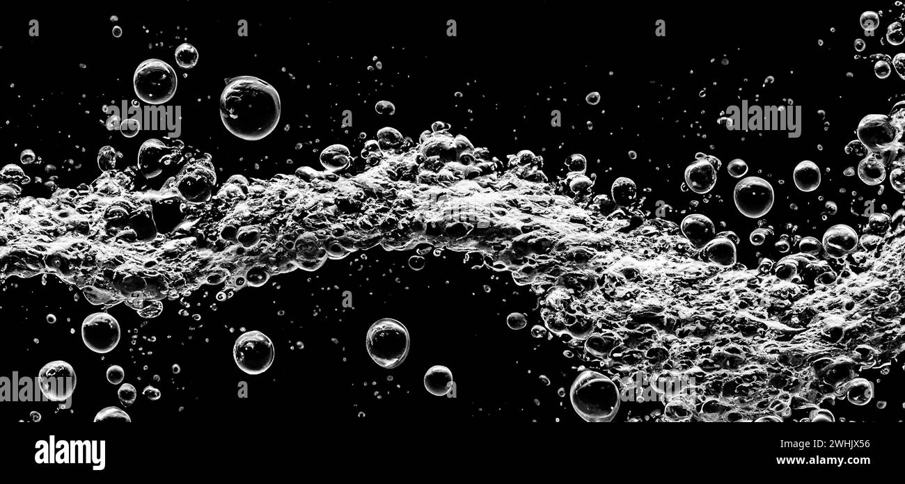 Soda water bubbles splashing underwater against black background. Soda ...