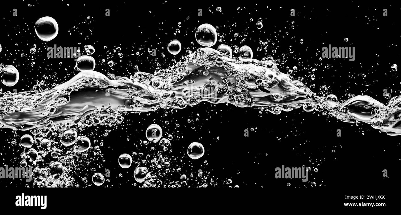 Soda water bubbles splashing underwater against black background. Soda ...