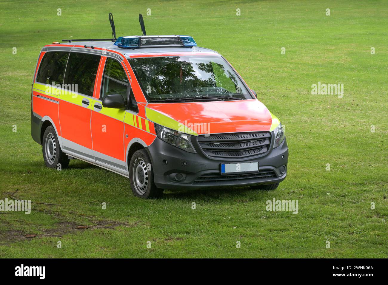 German emergency vehicle or fire engine on a meadow, red yellow marked ...