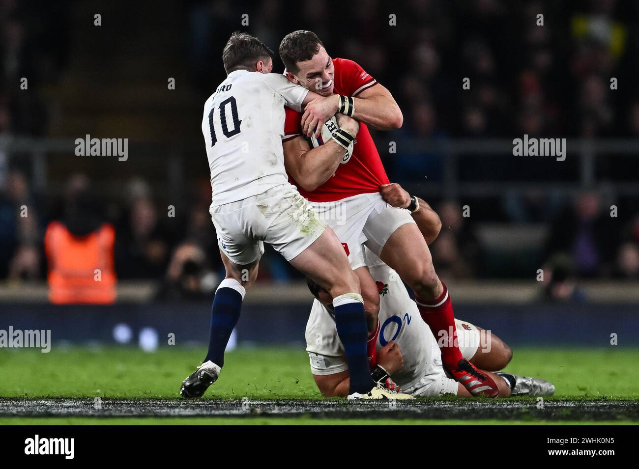 George North of Wales is tackled by Ellis Genge of England and George ...