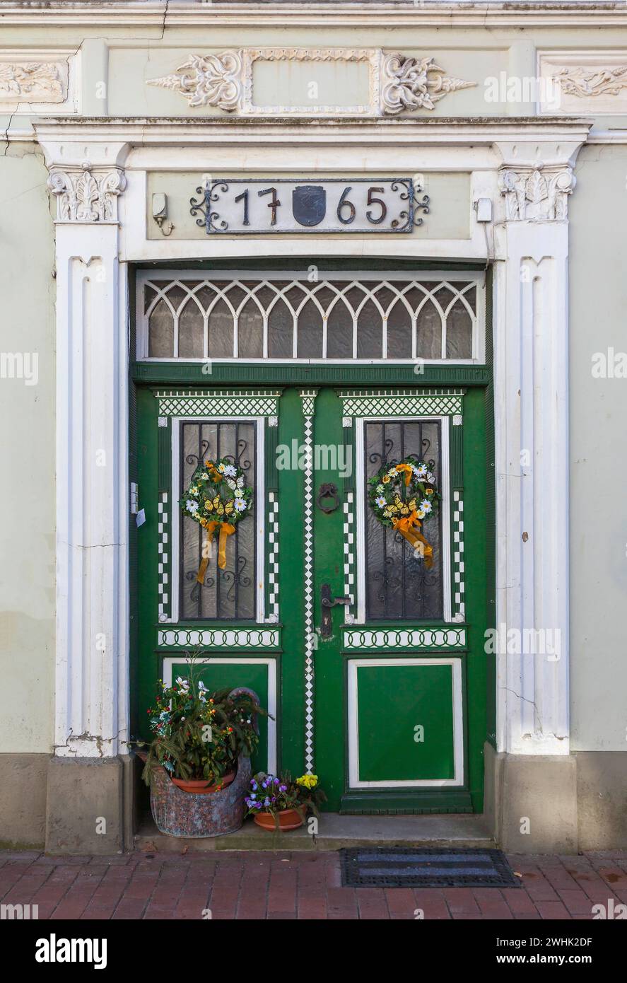 Old decorative front door in a historic house from 1765, Toenning ...