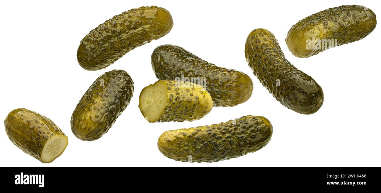 Marinated cucumbers, pickled gherkins isolated on white background ...