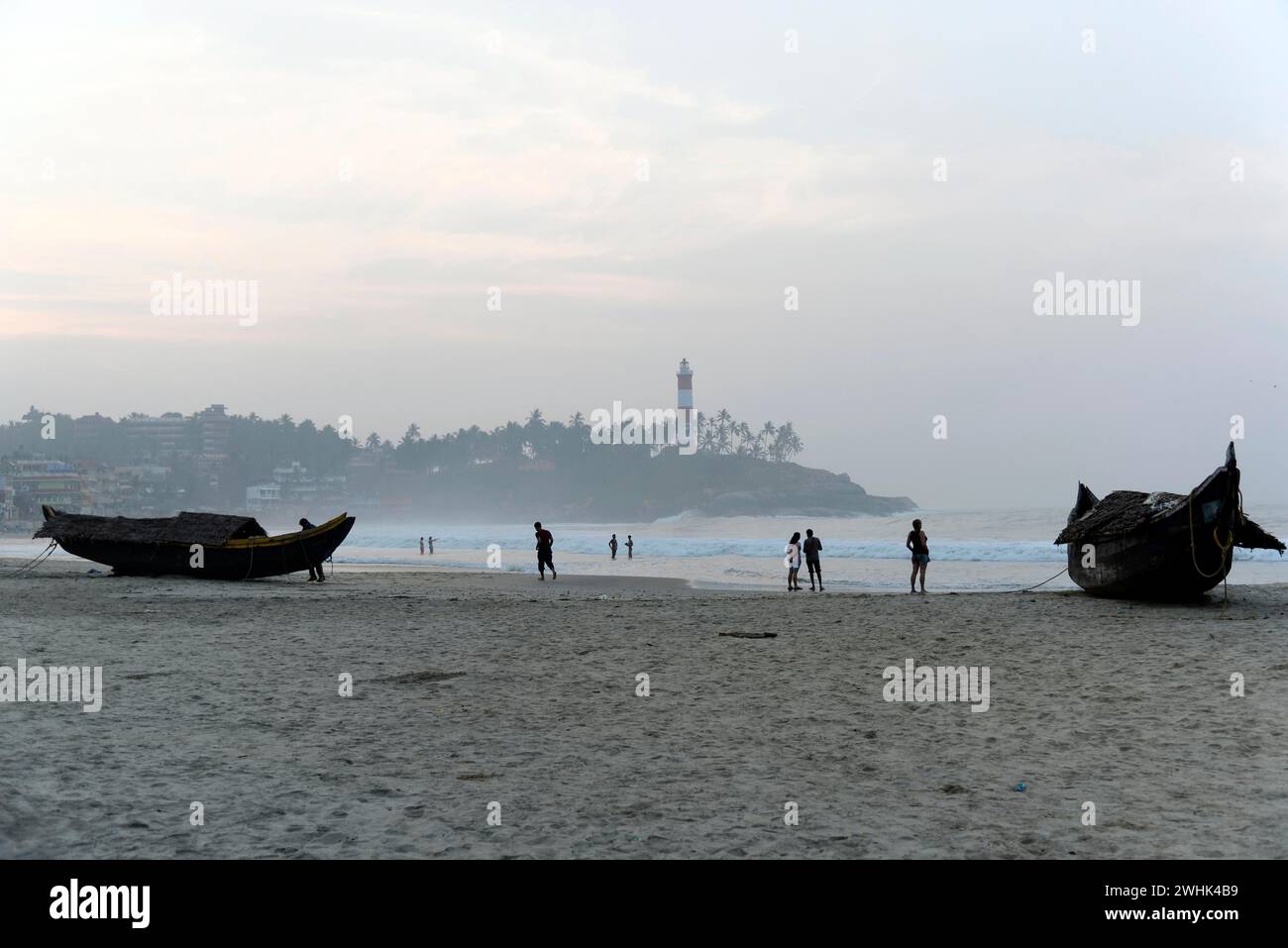 Holidaymakers on the beach of Kovalam, Malabar Coast, Malabar, Kerala ...
