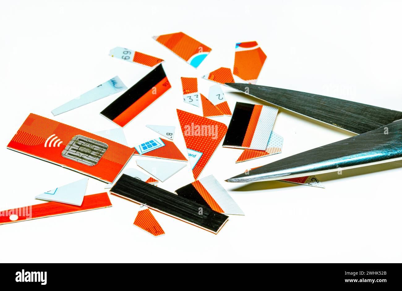 Credit card cut into many pieces and a Scissor. Cut credit card for ...