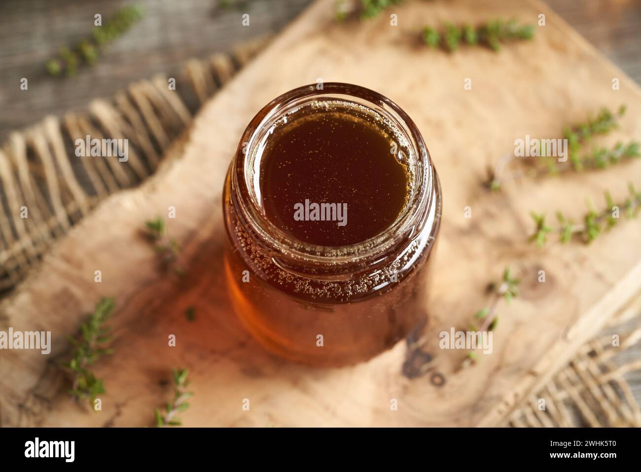 Homemade thyme syrup in a glass bottle Stock Photo - Alamy