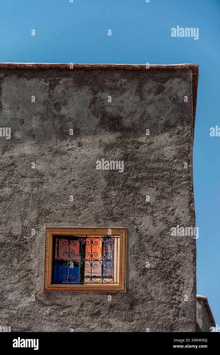 Clay plaster wall with colourful window, house, facade, house wall ...