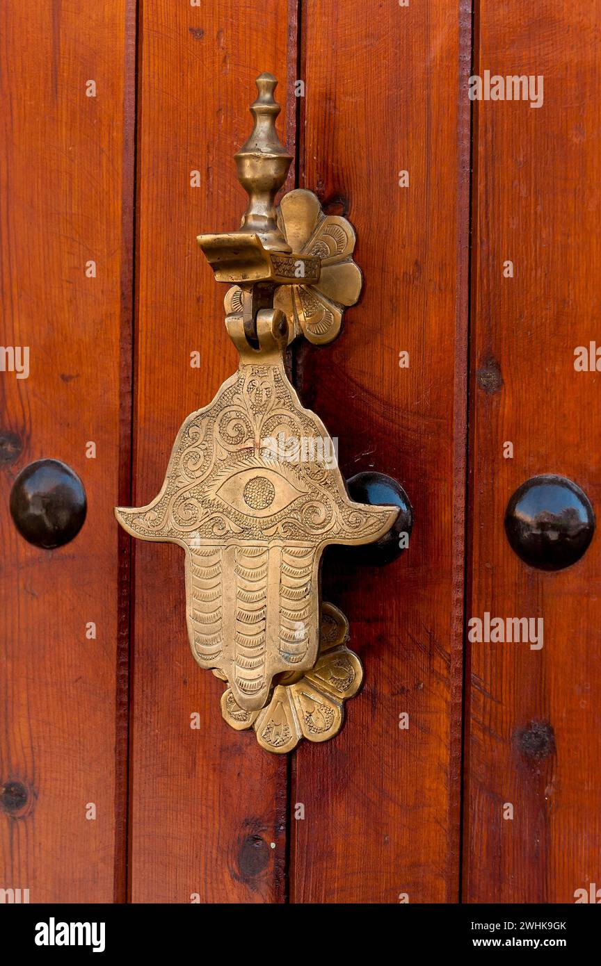 Traditional door knocker in hand shape, door fitting, door, brass, hand ...
