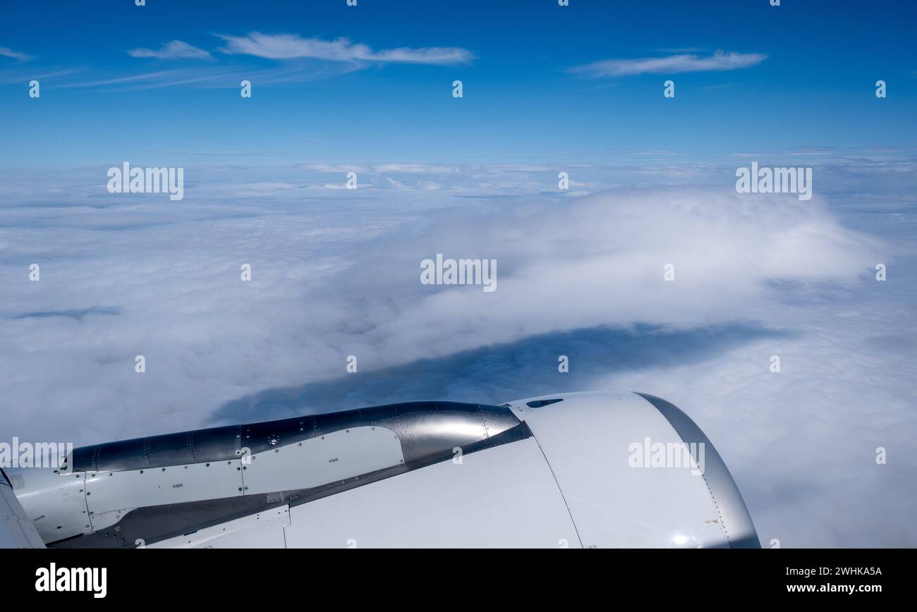 Airplane in flight. People travelling. Aerial view from plane window ...