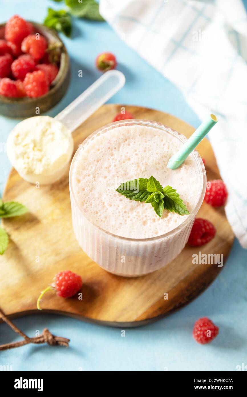 Protein shake with fresh berries. Fresh milk, raspberries drink on ...