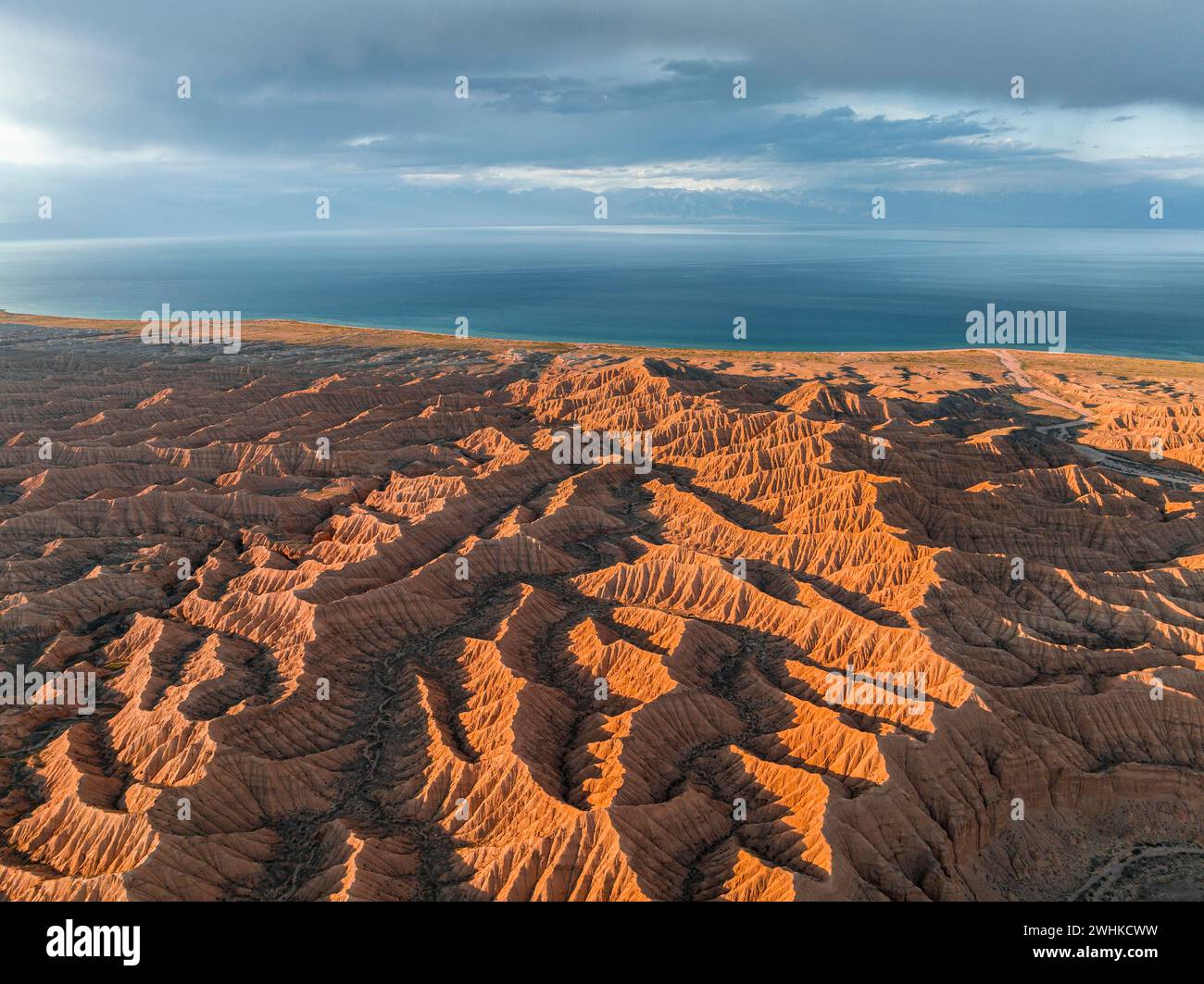 Landscape of eroded hills, badlands at sunset, Issyk Kul Lake in the ...