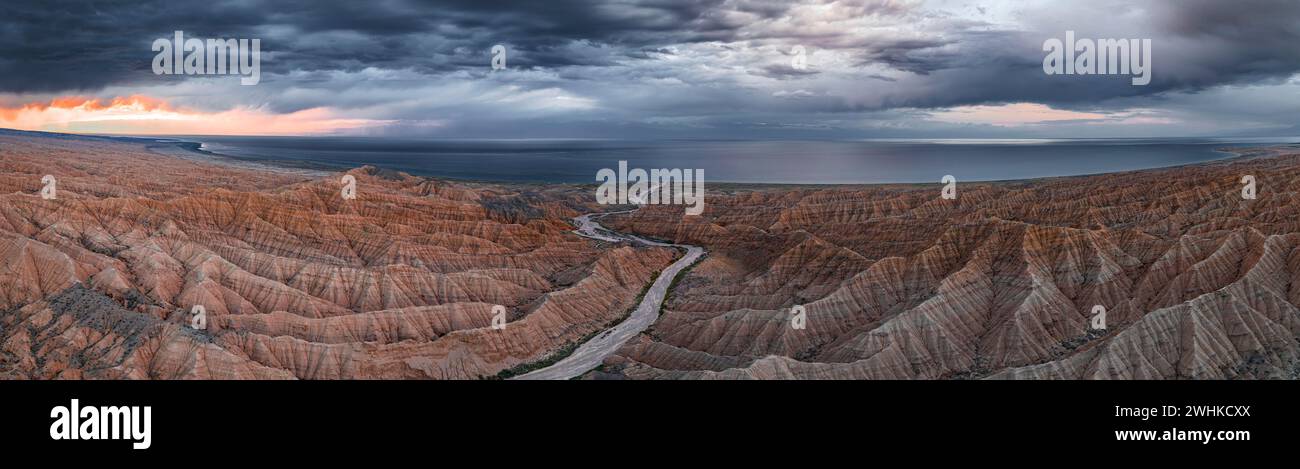 Panorama, landscape of eroded hills, badlands at sunset, Issyk Kul Lake ...