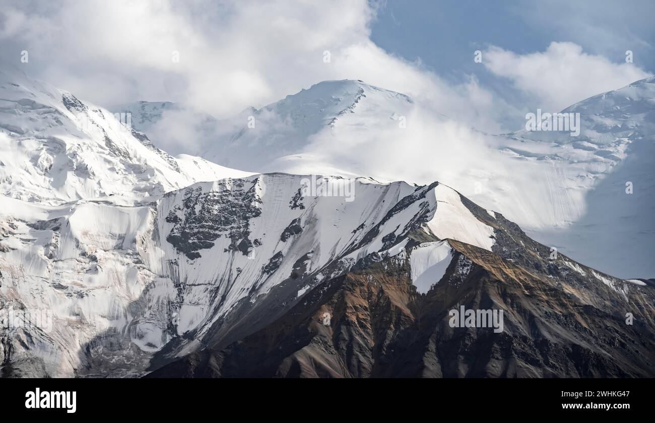 Dramatic mountain landscape, mountain valley, behind glaciated and snow ...