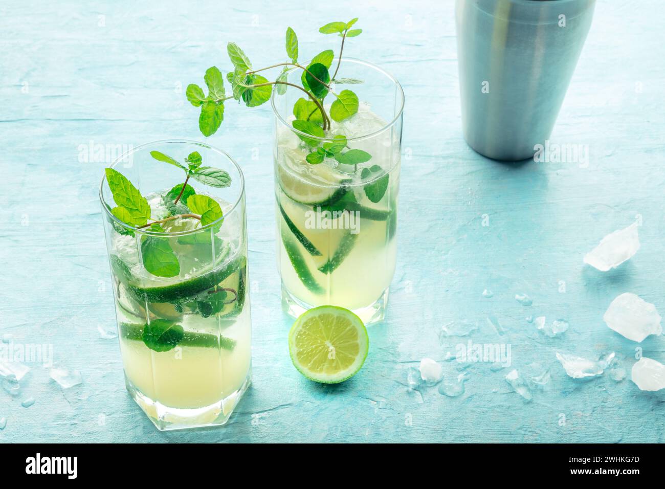 Mojito cocktail. Summer cold drink with lime, fresh mint, and ice. Cool ...
