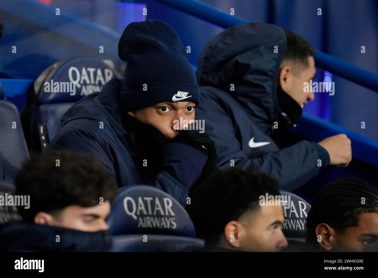 PSG's Kylian Mbappe, centre, sits on the bench during the French League ...