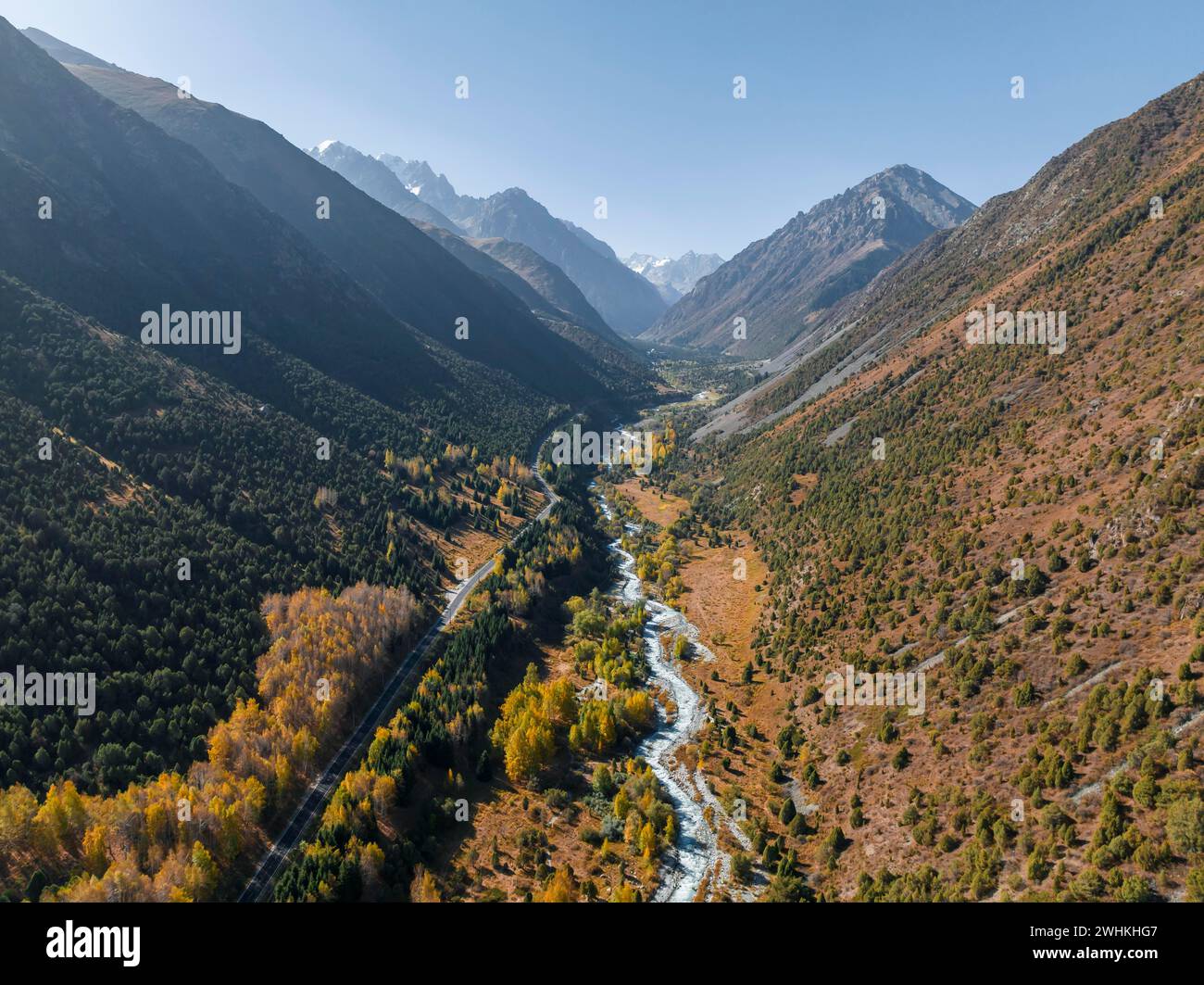 Aerial view, mountain stream Ala Archa flows through the Ala Archa valley, autumnal mountain ...