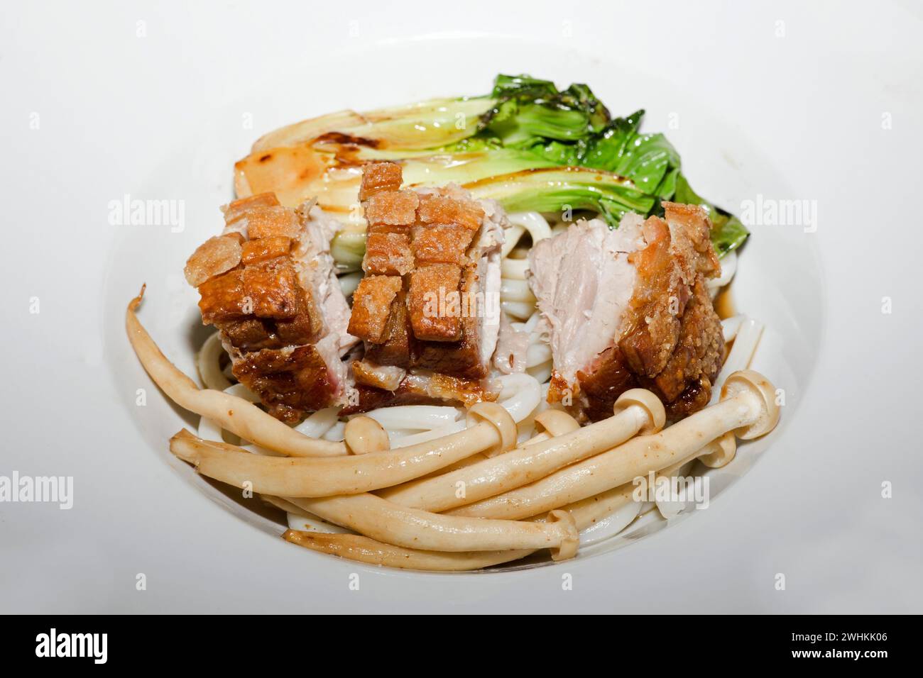 Crispy fried pork belly on Japanese udon noodles, with briefly braised ...