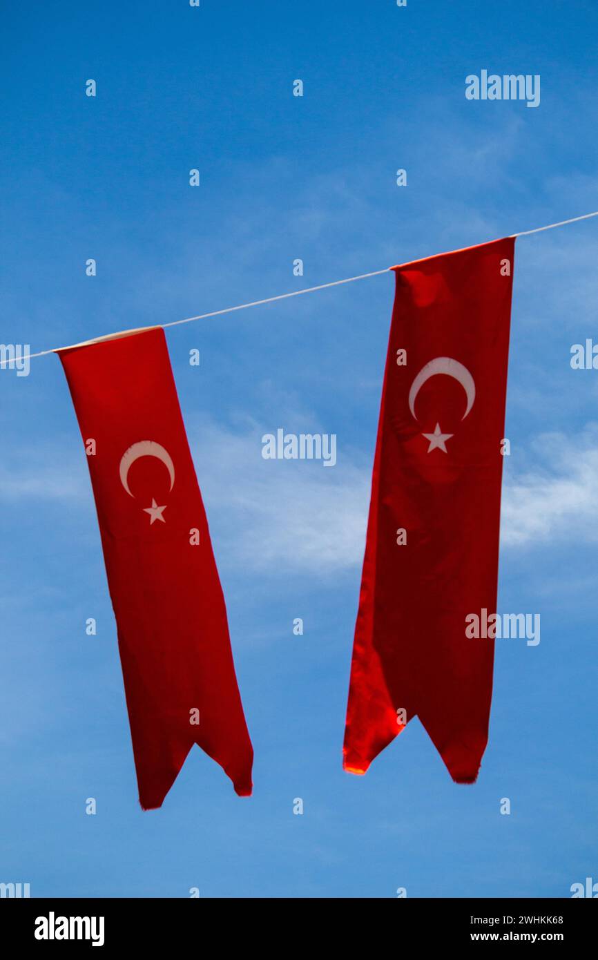 Turkish national flags with white star and moon in sky Stock Photo - Alamy
