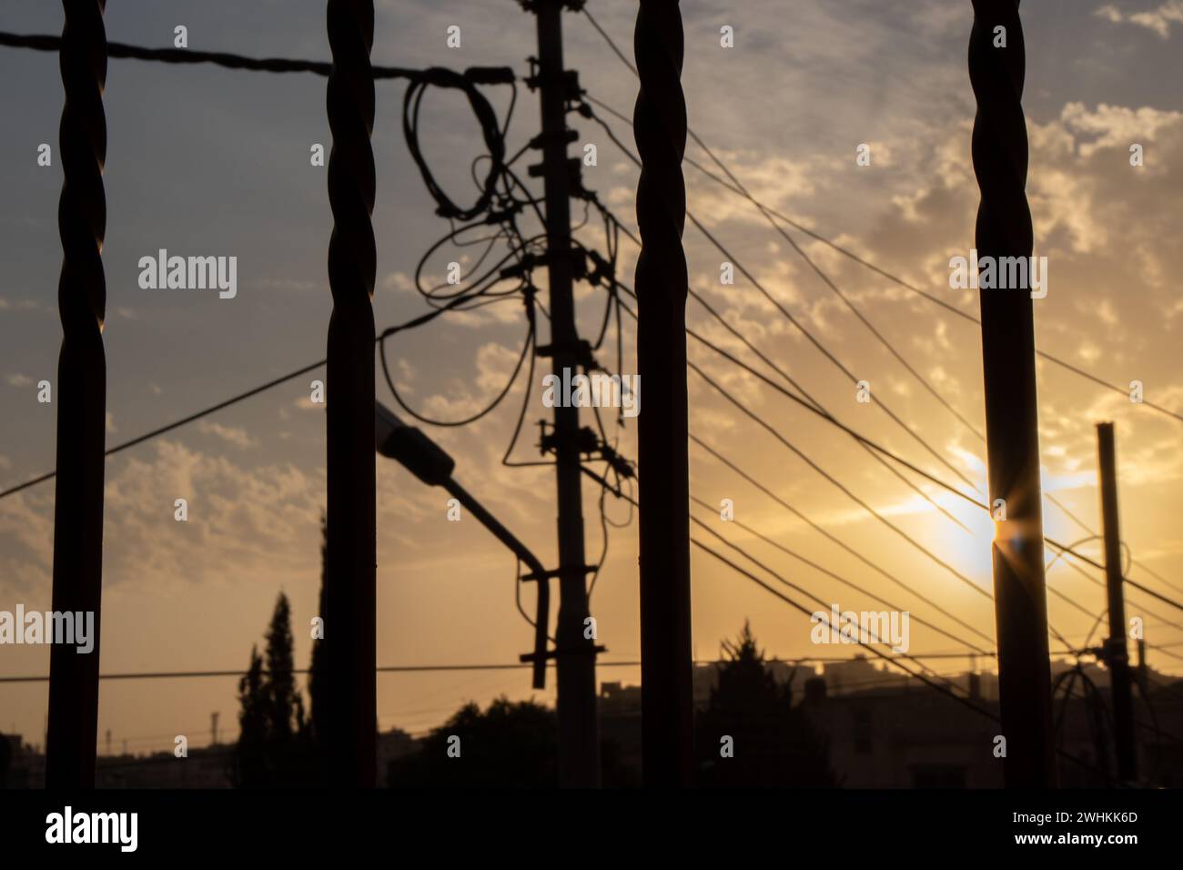 silhouette of electrical lines, fiber cables node and light at the ...