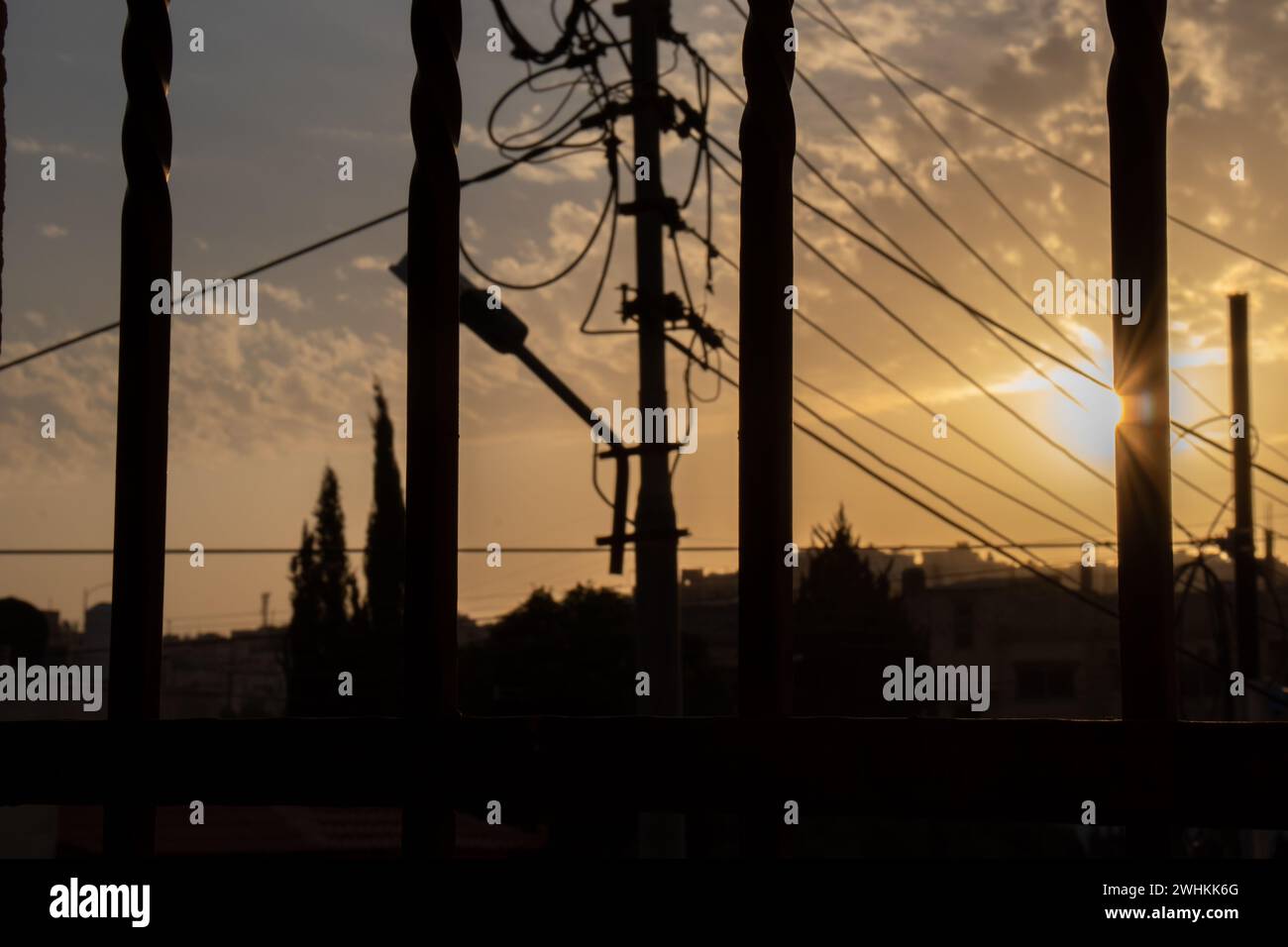 silhouette of electrical lines, fiber cables node and light at the ...